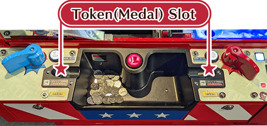 By Insert tokens (medals) into the token (medal) slot, they'll fall ...
